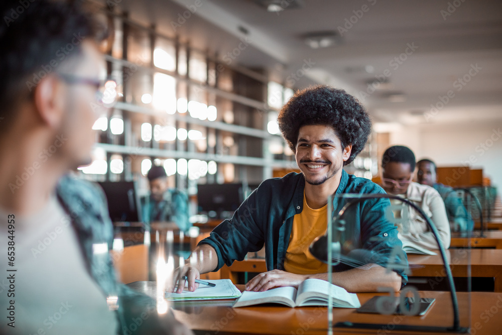 Young African American student reading and studying in the college ...