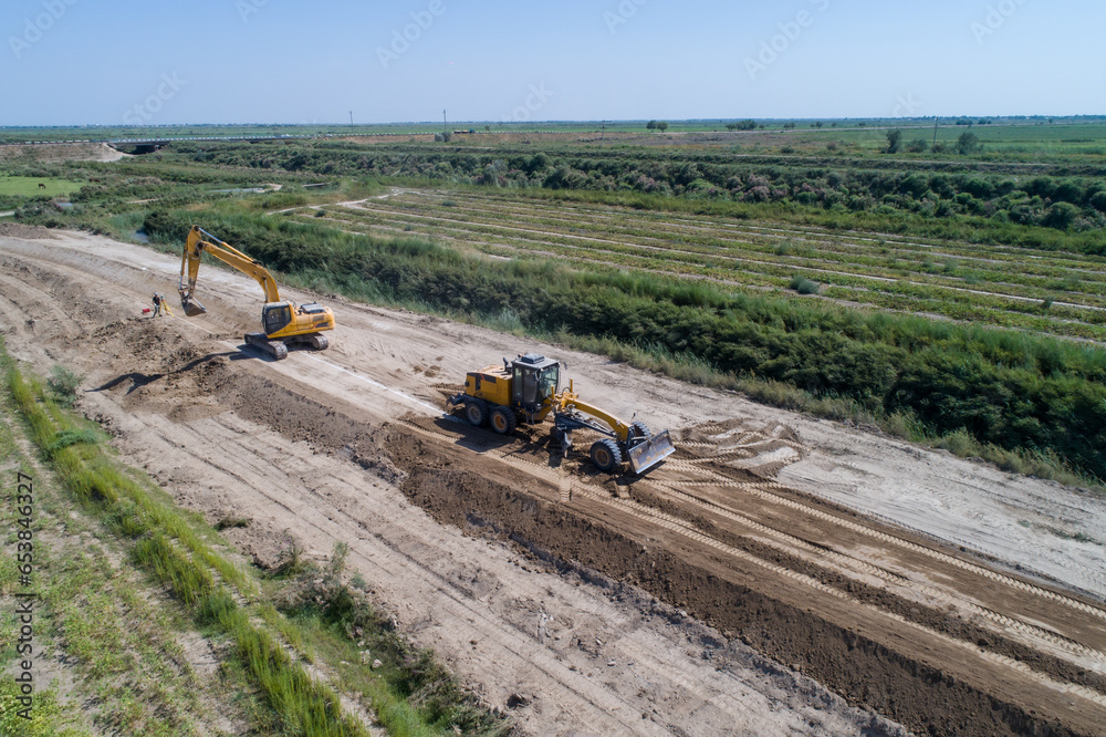 Construction of an irrigation canal. Earthworks, laying the foundation ...