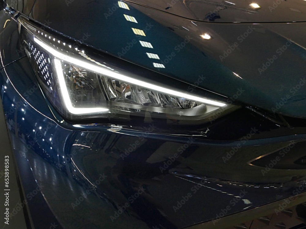 Headlight of modern spanish battery electric compact family car Cupra ...
