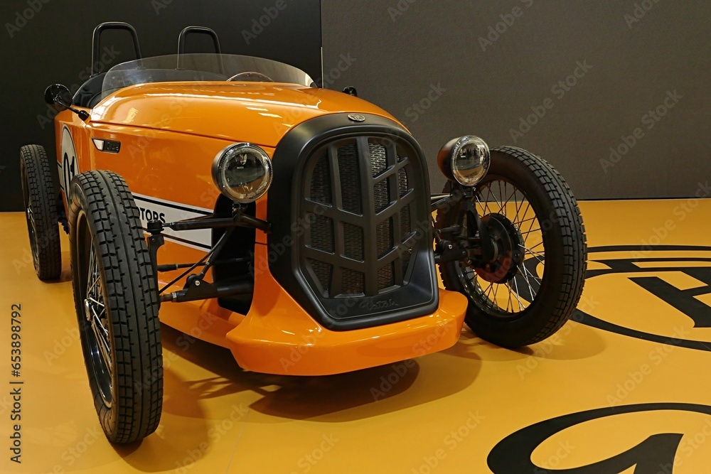 Orange gasoline version of stylish retro looking microcar roadster ...
