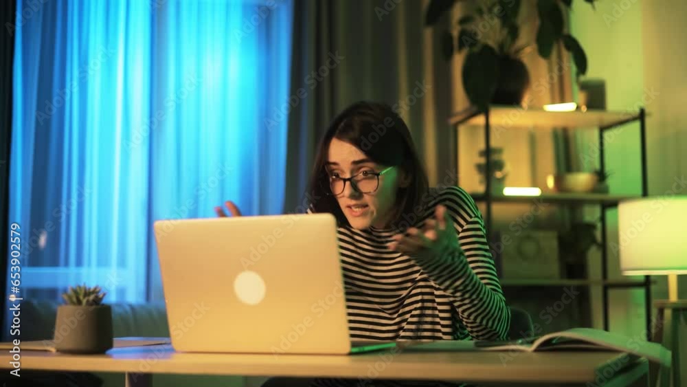 Irritated arguing young woman looking at laptop screen yelling indoors ...