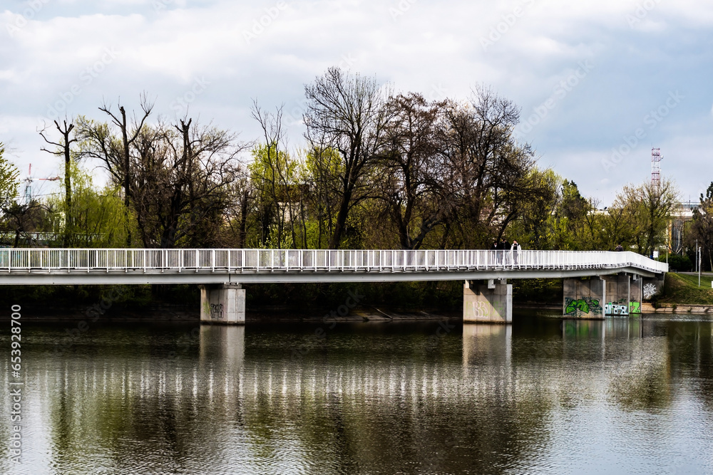 Pedestrian bridge in Bordei park over the lake. Bucharest, Romania ...