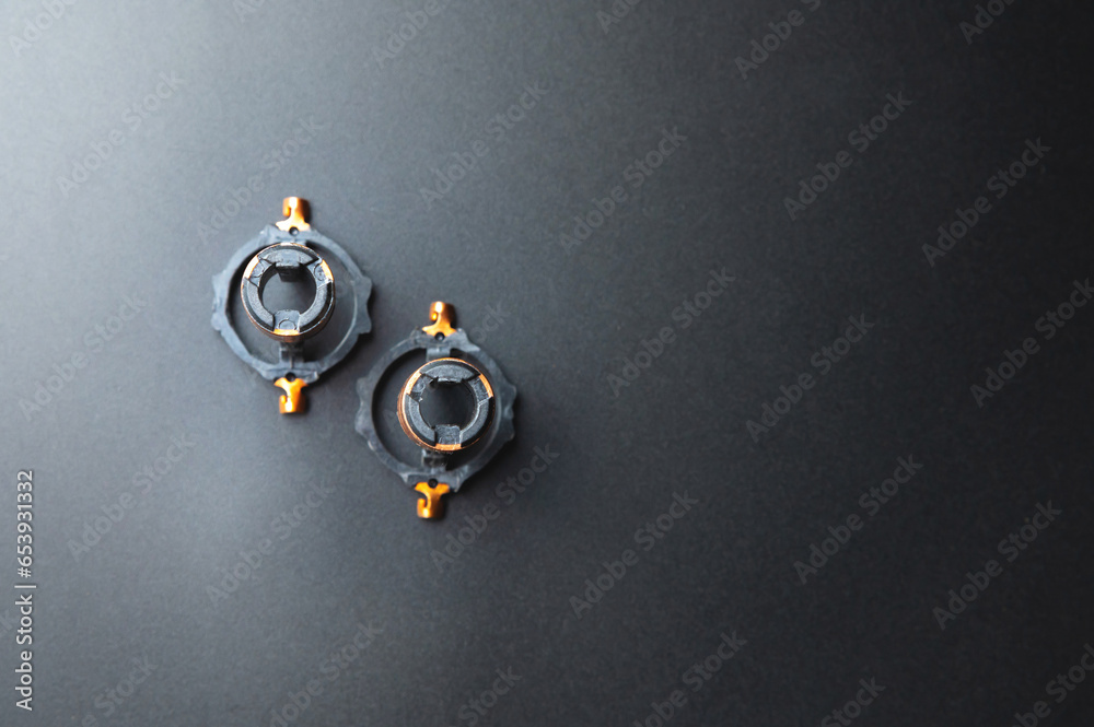 New spare parts. Generator slip rings on a black background. Auto ...