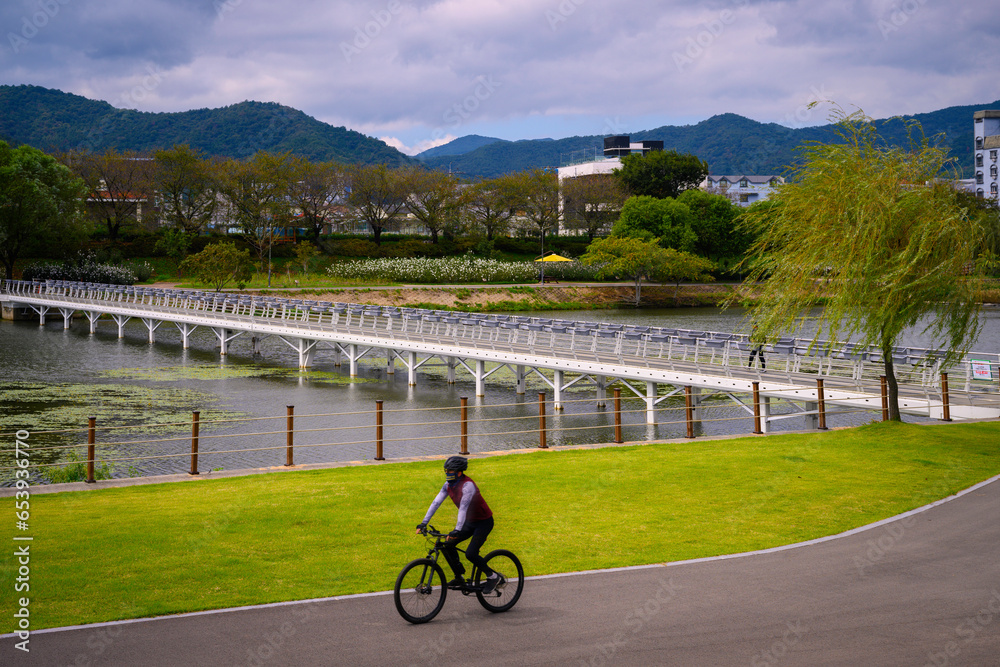Suncheon City riverwalk and bike lane landscape with Poongdeok Swing ...