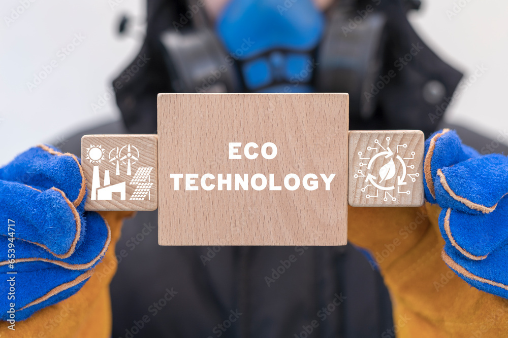 Worker holding wooden blocks sees text: ECO TECHNOLOGY. Environmental ...