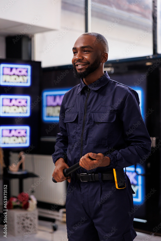 Smiling friendly African American security guard wearing uniform ...