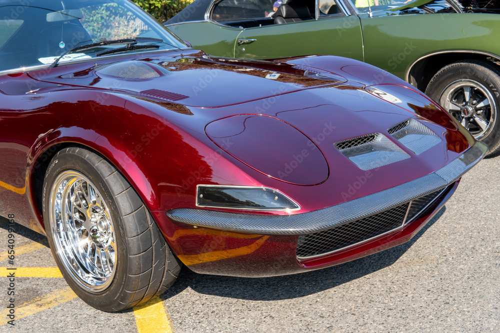 Snohomish, WA, USA - 25 September 2022. Headlights of 1973 Dark red ...