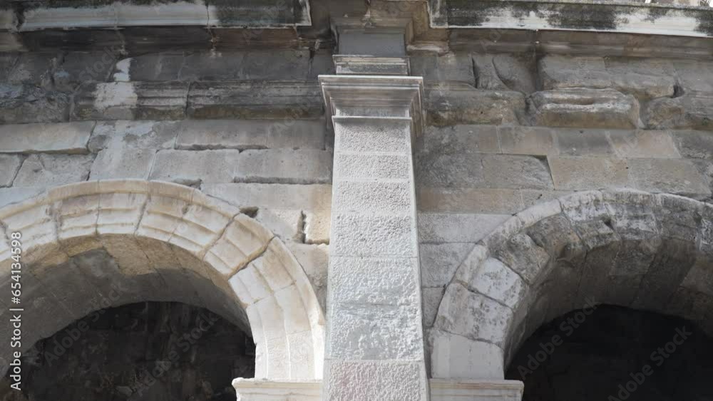 The columns and arches of a Roman arena Stock Video | Adobe Stock