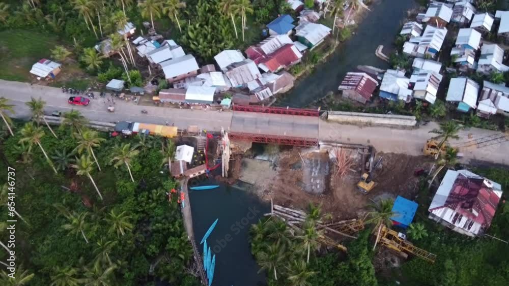 Construction work at Maasin river bridge by the bent palm tree swing on ...