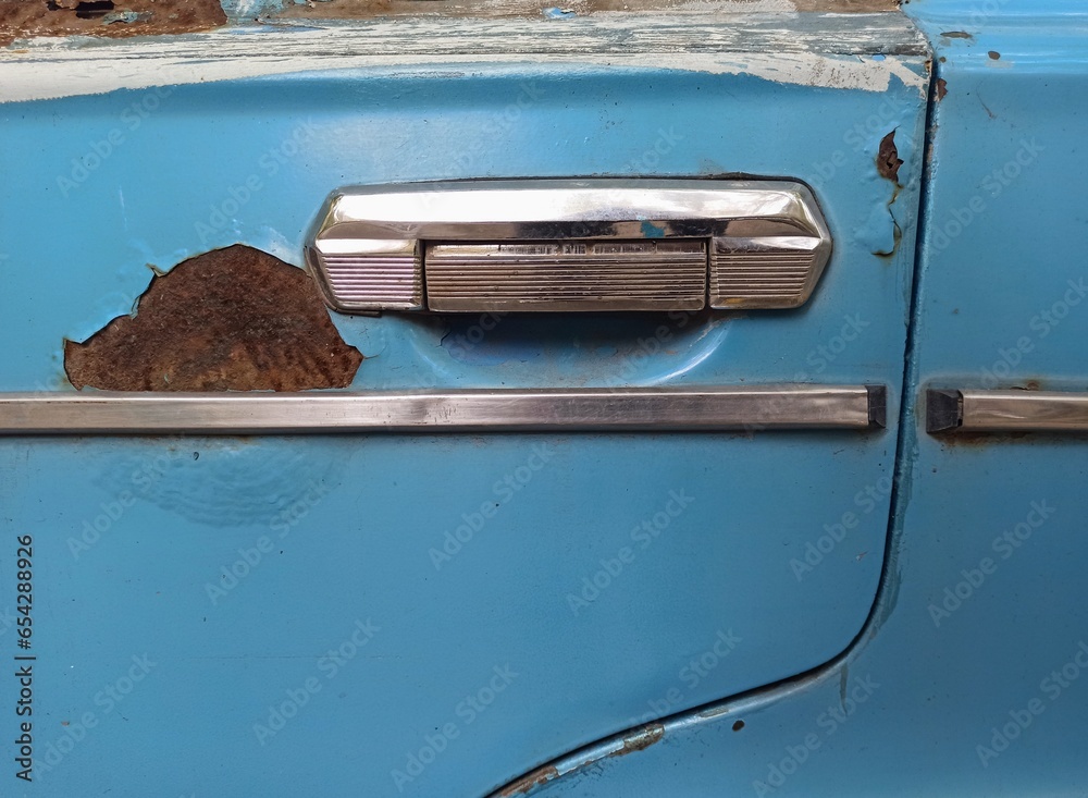 Old blue car door with rusty lock and keyhole, vintage car background ...