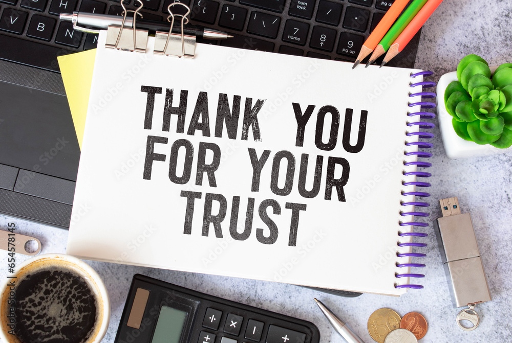 Thank you for your trust. text on white paper over torn paper ...