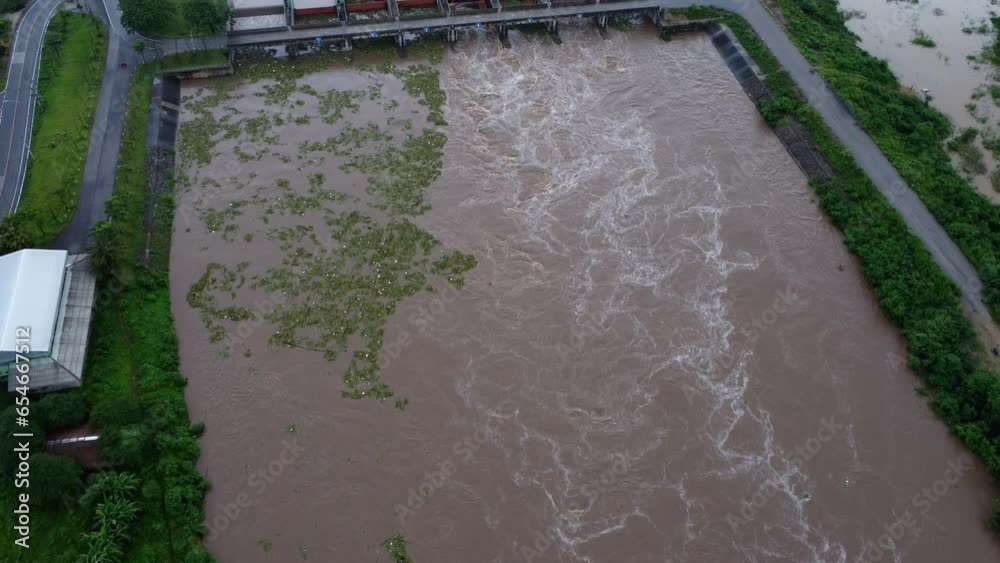 Aerial view of the water released from the concrete dam's drainage ...