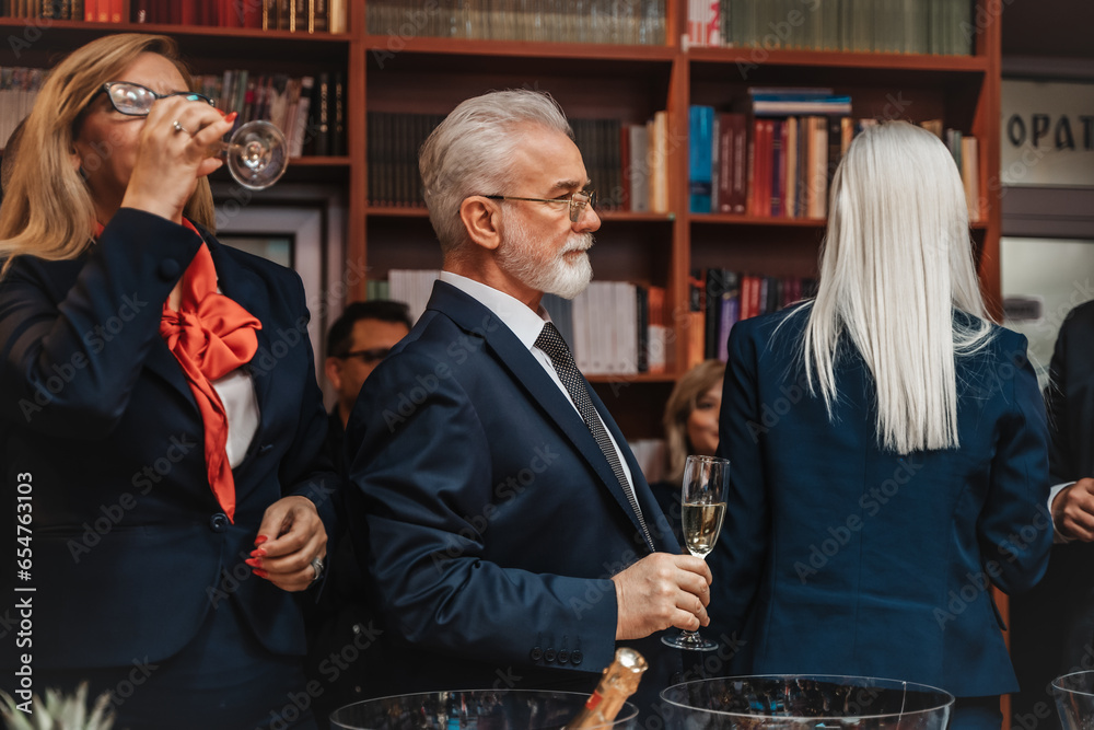 Accomplishment and celebration as diverse business professionals toast ...