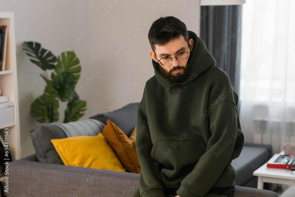 Sad man pondering about his life after a relationship breakup or ...