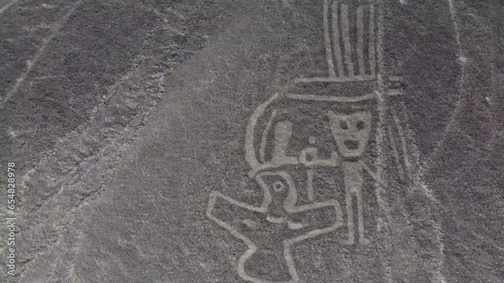 Small human figures and bird of the Nazca Lines geoglyphs made in the ...