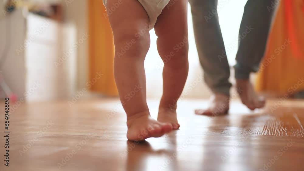 baby first steps. happy family a kid dream concept. father teaches baby ...