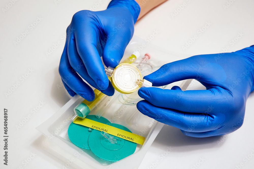 Epidural filter in the doctor's hands. Preparing for epidural ...