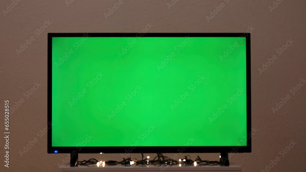 Green TV screen with flashing garland. Concept. Garland flashes on ...