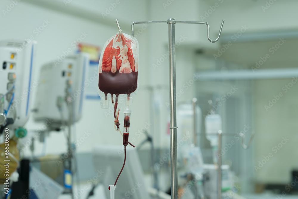 Fototapeta The patient is receiving blood components to replace lost ...