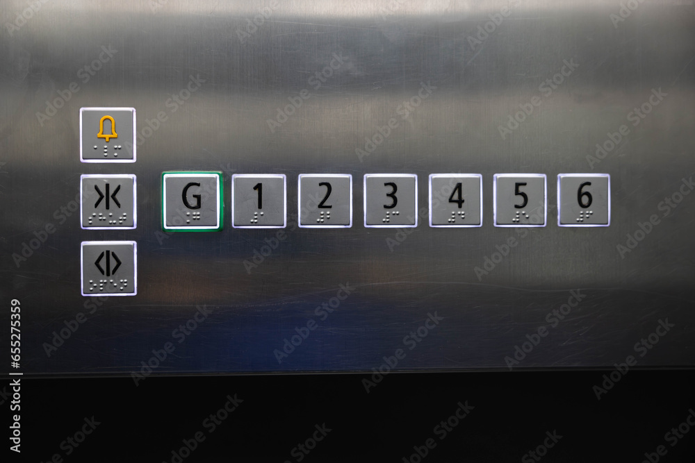 braille signage on elevator buttons on the stainless steel wall ... braille signage on elevator buttons on the stainless steel wall ...