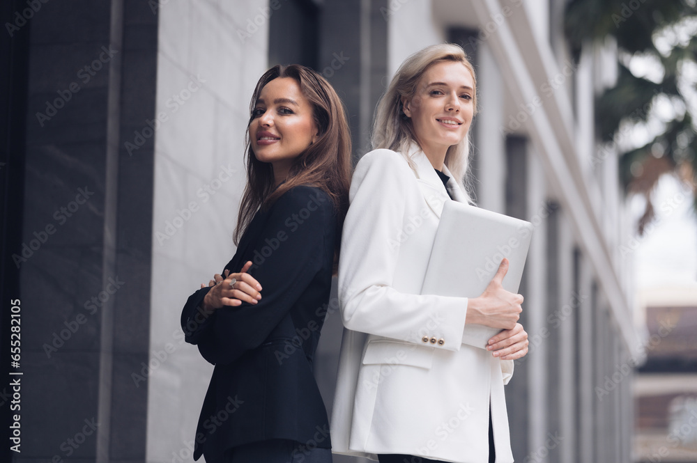 Successful business women of different nationalities work together ...