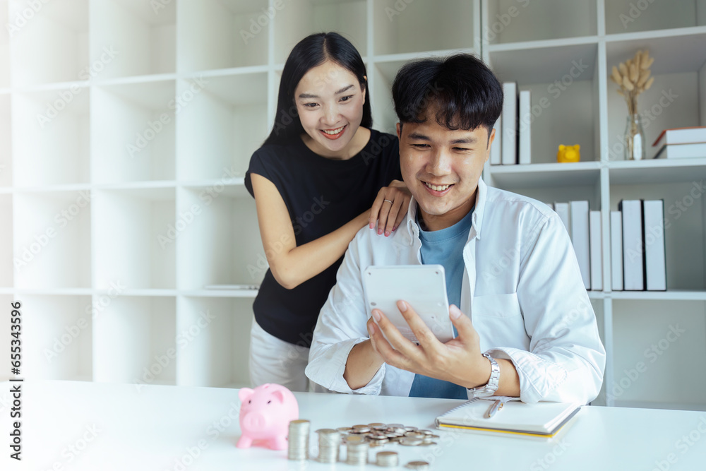 financial in family concept, Happy Asian husband and wife calculating ...