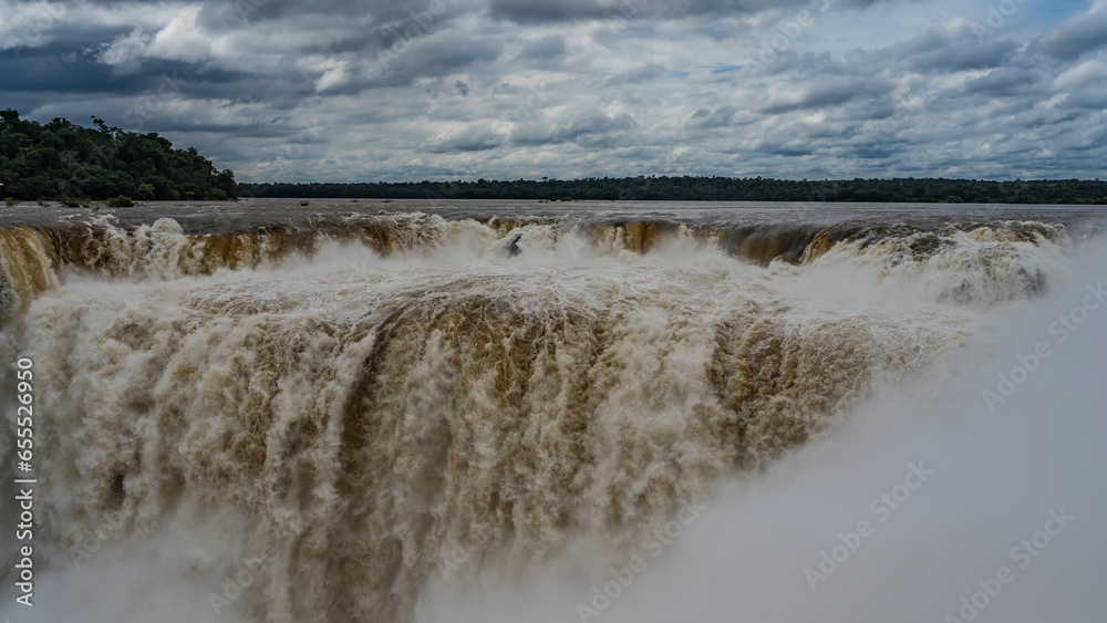 The impressive famous Devil's Throat Waterfall. Powerful streams of ...