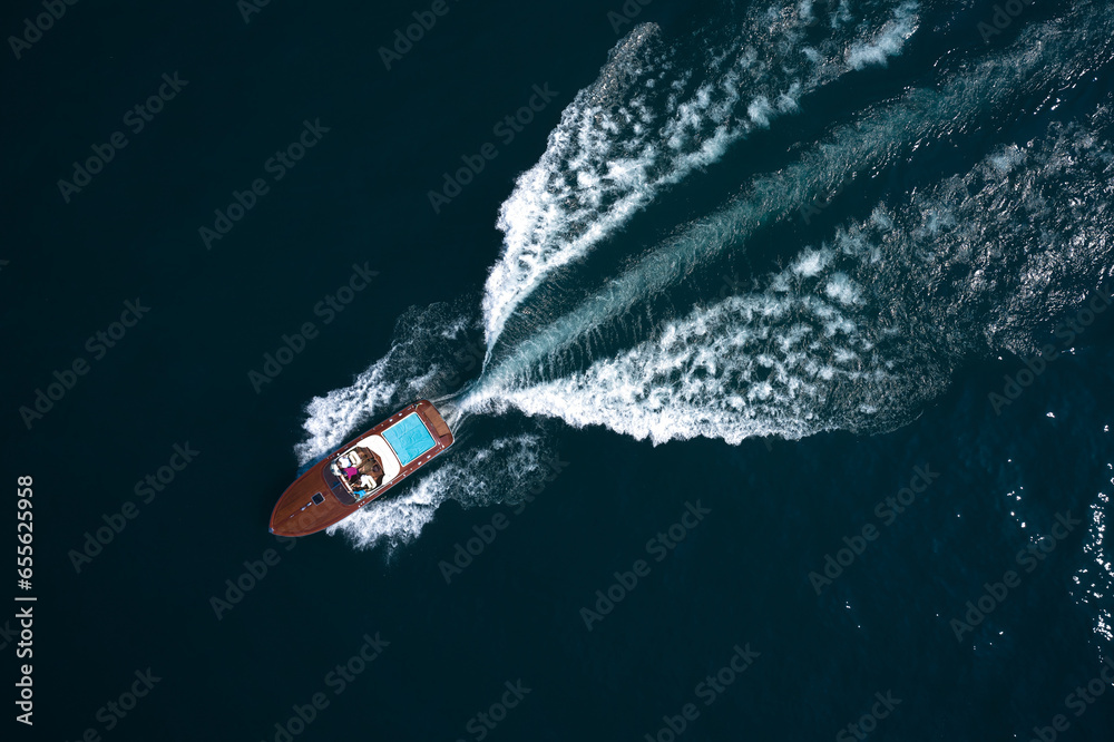 Motor boat in motion. Luxury wooden big speedboat fast moving on dark ...
