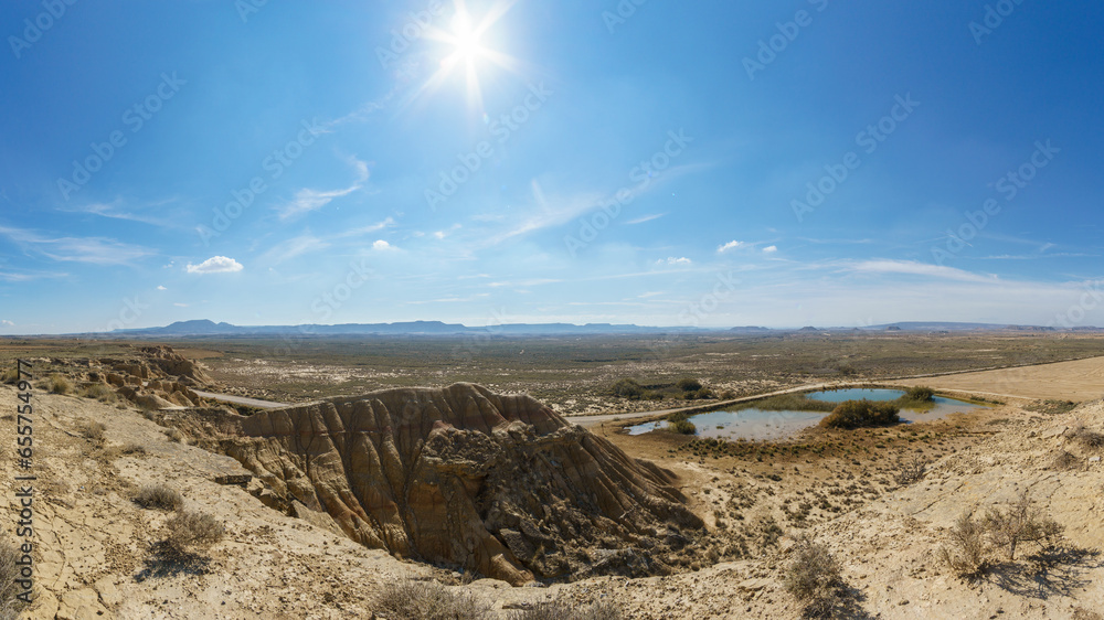 Desert landscape of the arid plateau of the Bardenas Reales with small ...