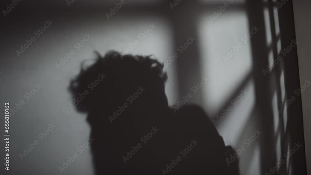 Shadow of man with schizophrenia on gray wall in psychiatric hospital ...