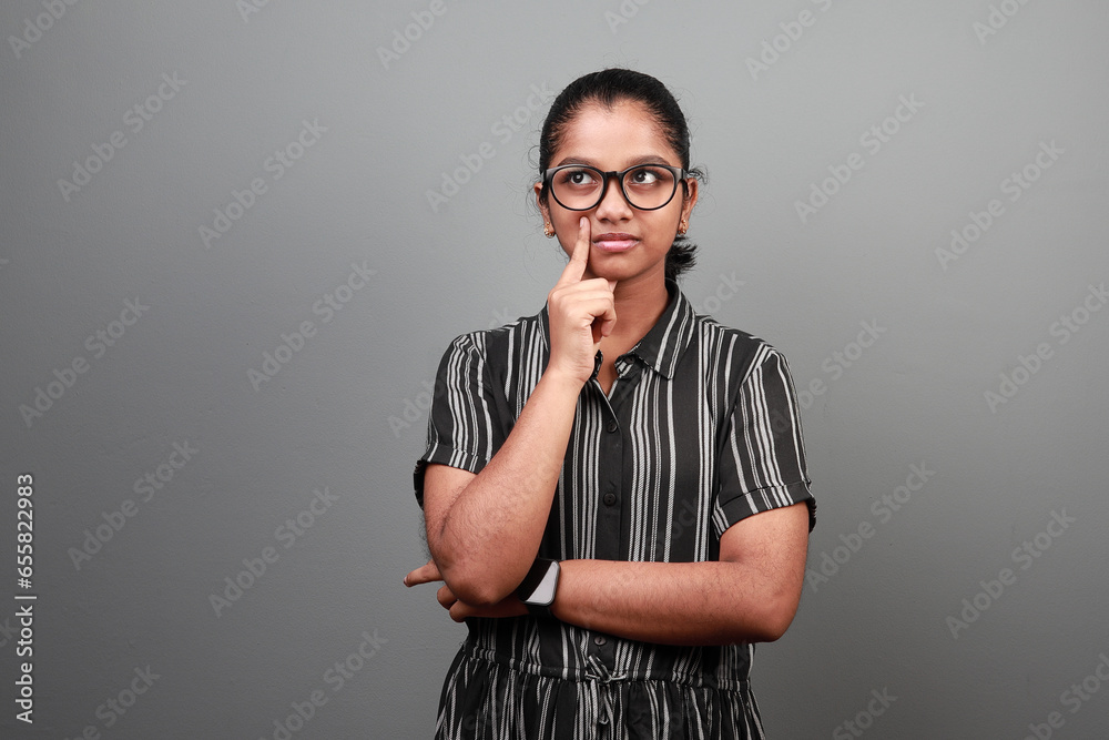 Young girl of Indian ethnicity with a confused face expression Stock ...