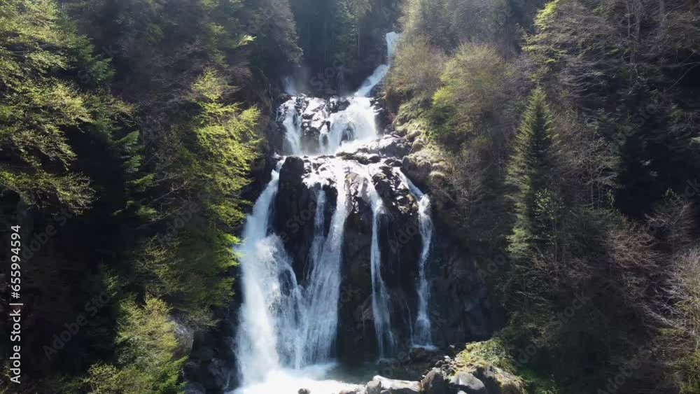 Aerial drone footage of beautiful Cascade du Lutour, flying towards the ...