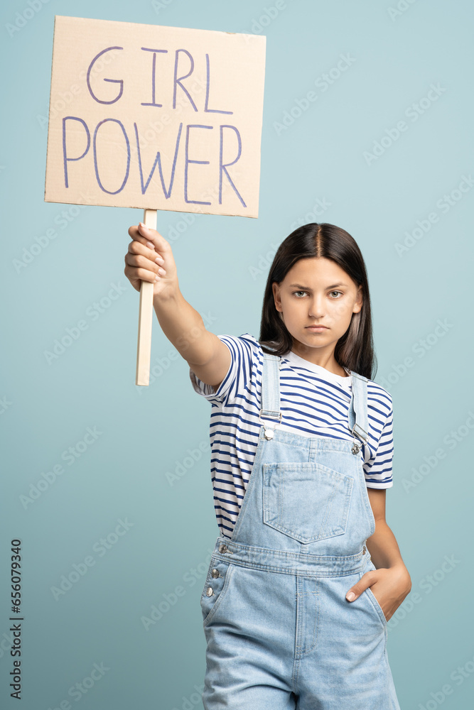 Teenage girl holds banner girl power. Picketing, fighting for women's ...