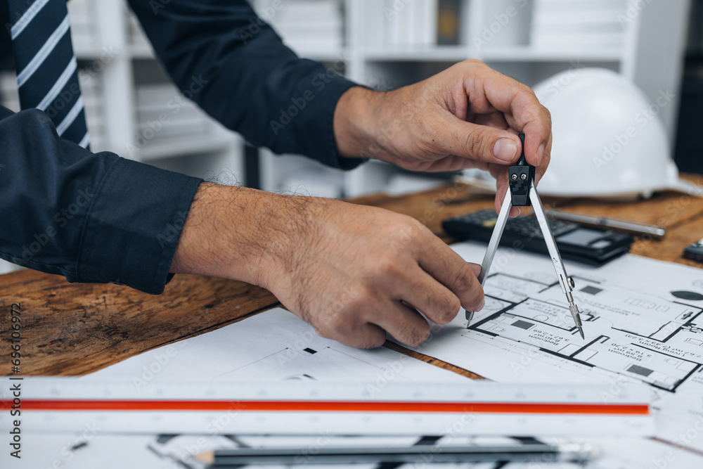 Architects sketch and edit real estate building plans, design buildings ...