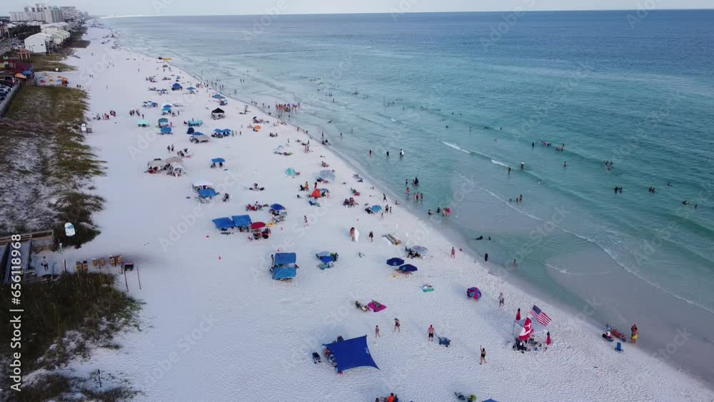Sugar white sandy beach Gulf shores with crowded of people swimming ...