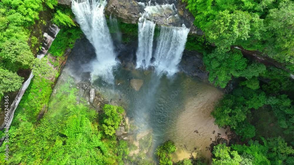 An epic waterfall adventure awaits in a vibrant, green jungle paradise ...