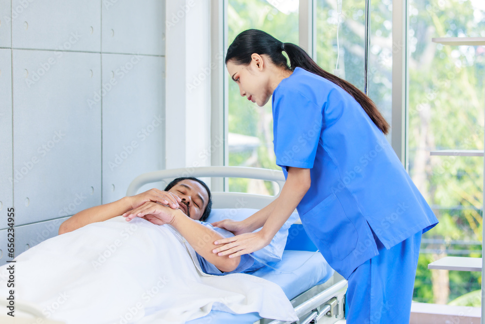 Asian professional experienced young female nurse in blue hospital ...