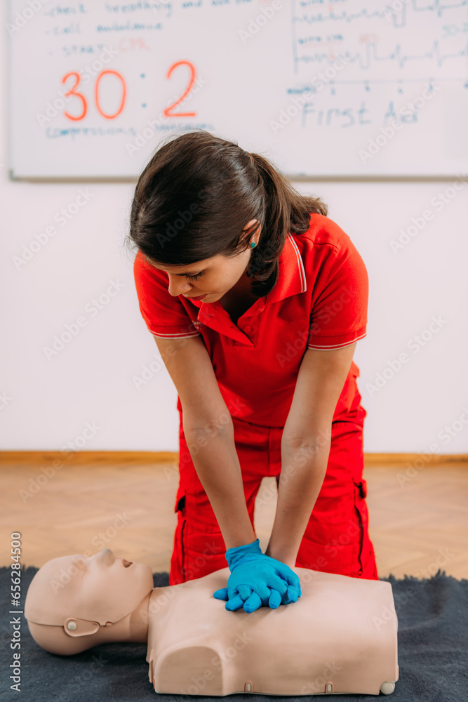Chest compression techniques in a CPR first aid training with a dummy ...