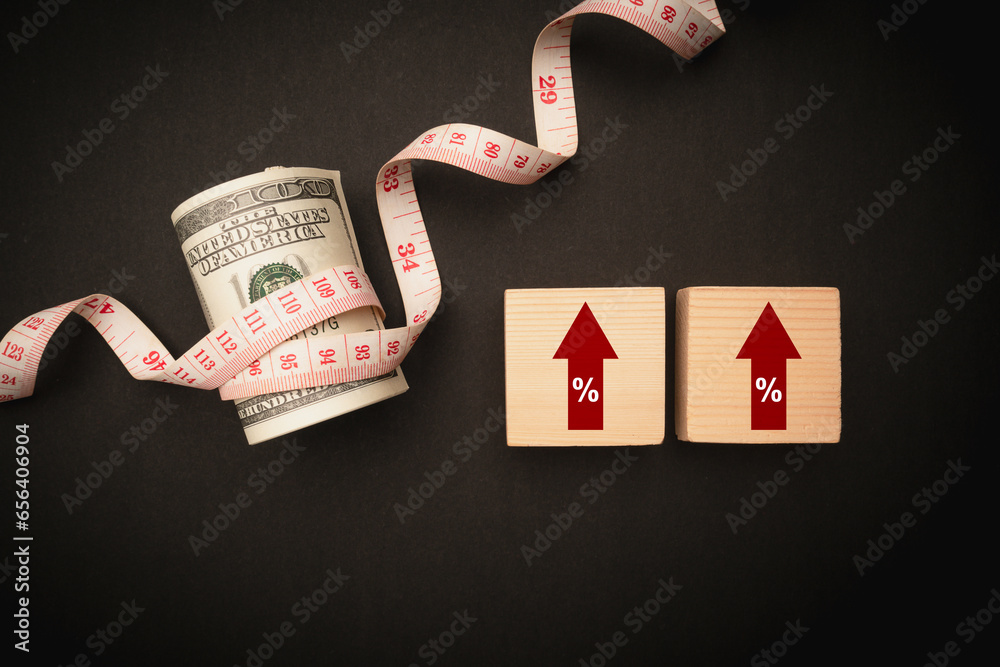 Interest rate increase. A tape measure was wrapped around a US dollar ...