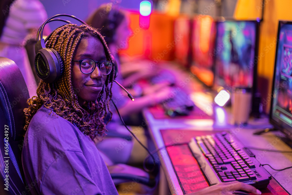 Diverse team of professional gamers with players of African ethnicity ...