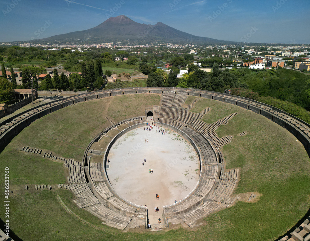Ancient roman Colosseum at Pompeii on the shadow of Mount Vesuvius ...