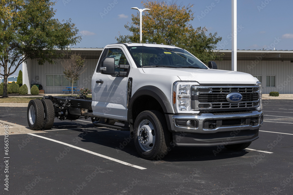 Ford F-550 Super Duty 4X4 Chassis Cab display at a dealership. The Ford F550 comes in gas or ...