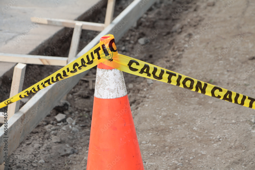 sidewalk construction building dug out up with wood frame and pylons ...