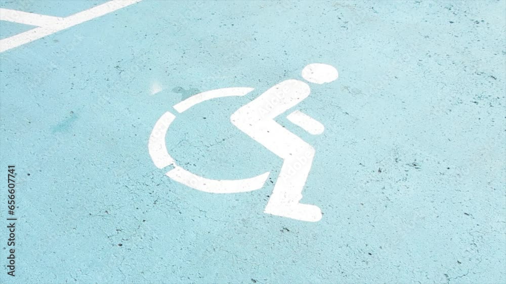 handicap symbol on cement pavement concrete with blue background ...