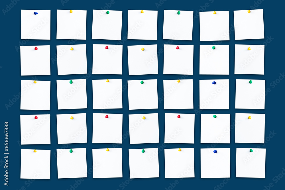 Sticky notes background. Reminder cards pinned to blue wall. Office ...