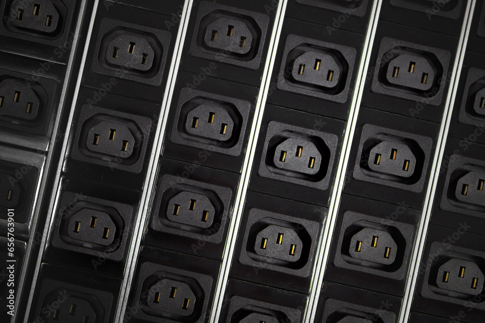 Rail detail with electricity sockets (IEC 60320 C13). Stock Photo ...
