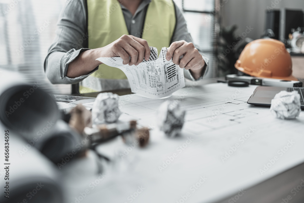 The architect made a mistake in designing the plan and torn paper ...