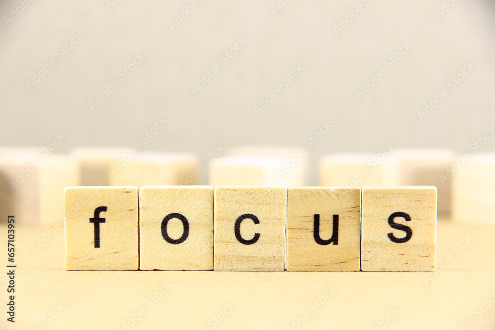 Short word english letter with text "focus" on a small wooden cubes ...