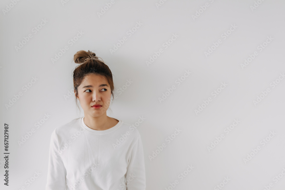 Asian Thai woman bun hair dislike sad face, sad and sulking and ...