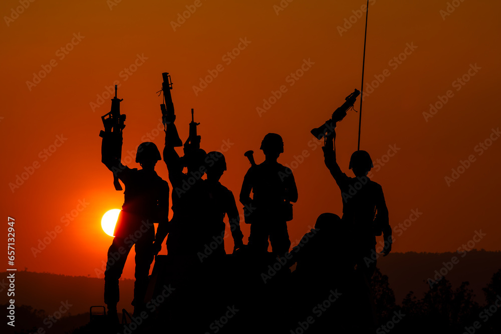 silhouette group of special forces sodiers standing and sit holding gun ...